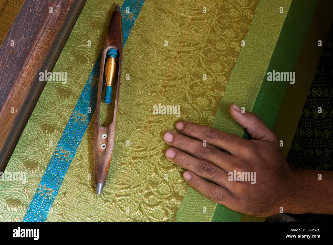Hand loom, silk bobbins and finished silk sari in an Indian cottage ...