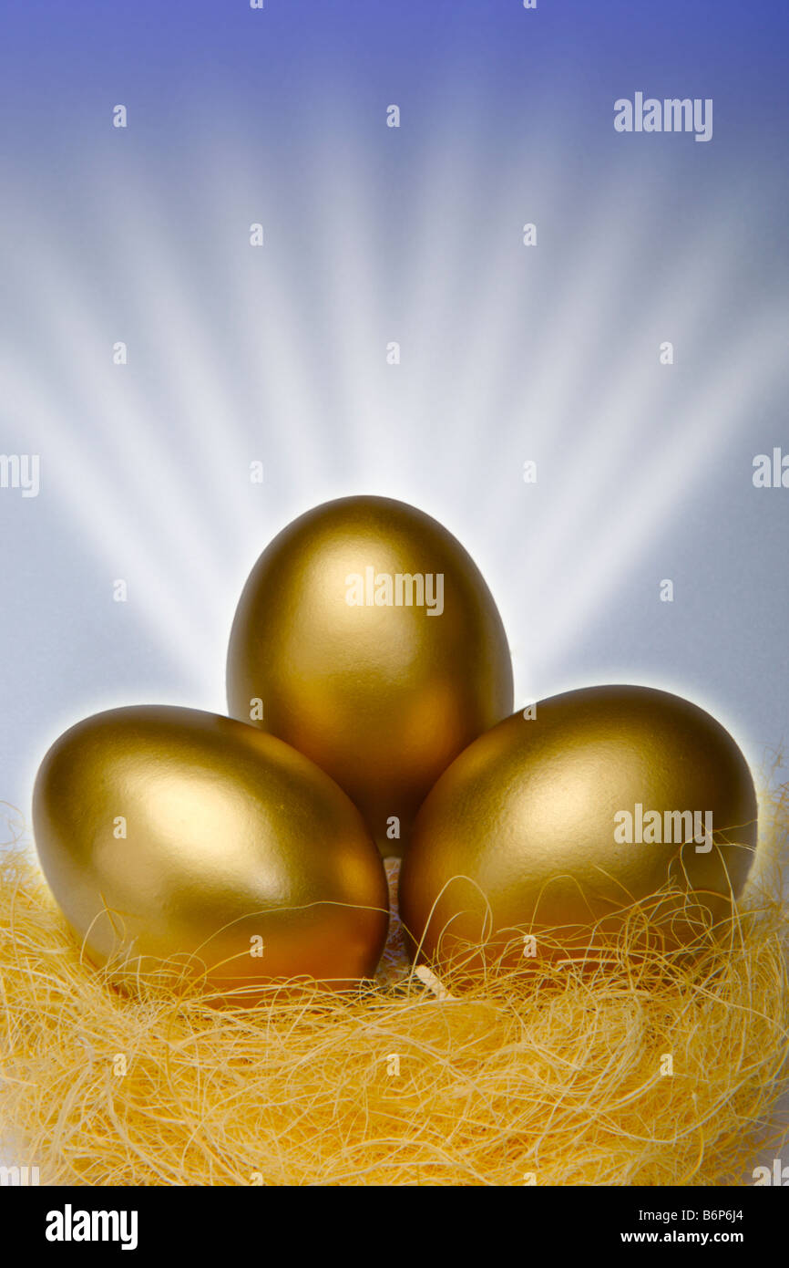 Golden eggs in a nest with rays of light to signify savings or wealth ...