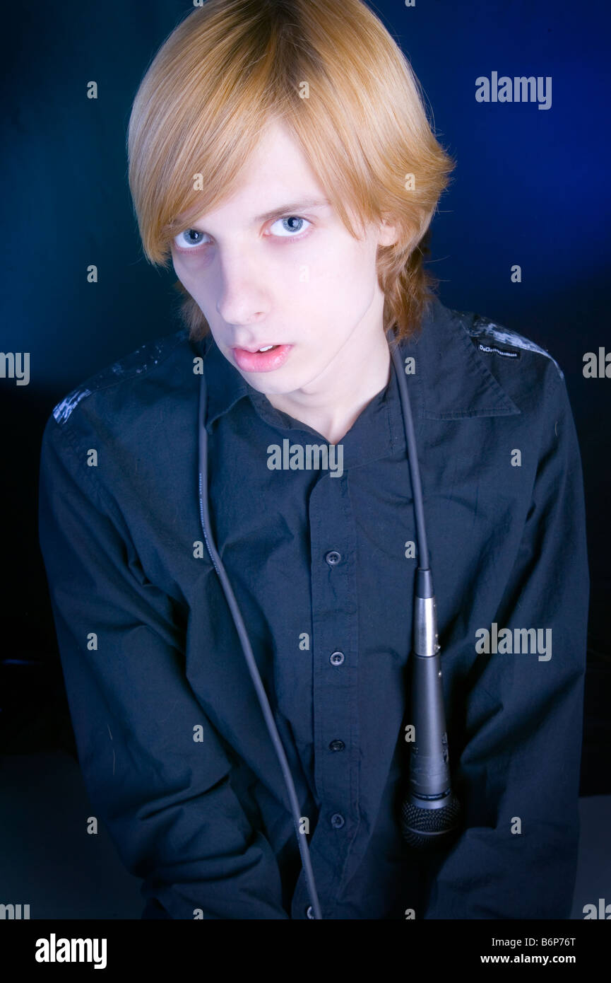 A young man with a microphone around his neck Stock Photo - Alamy