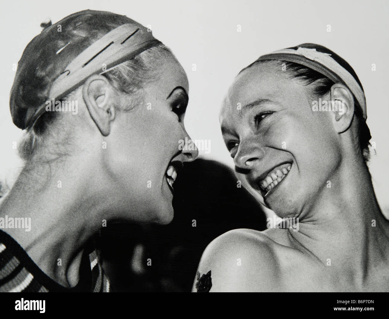 two fashion models backstage of fashionshow laughing at each other in ...