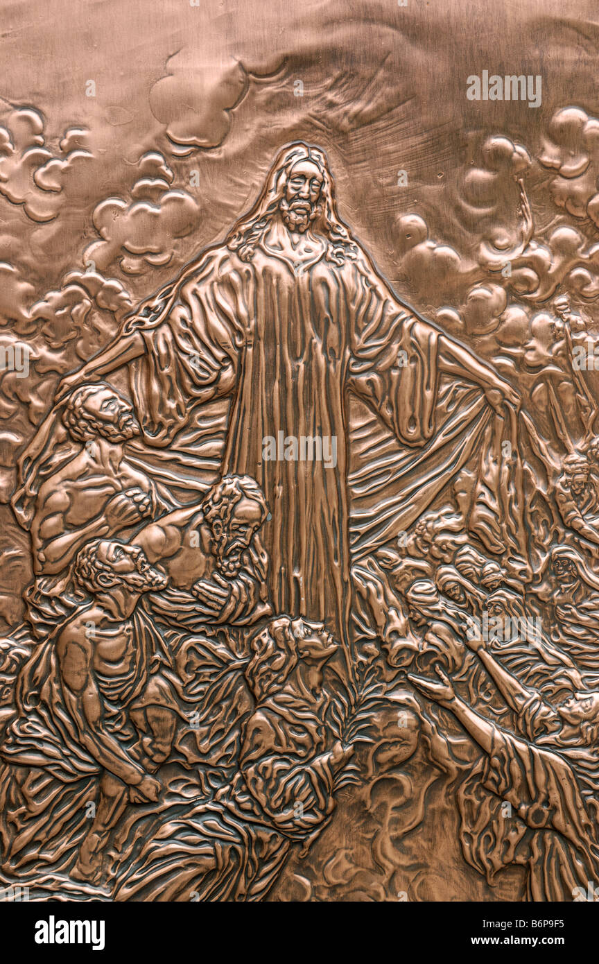 Biblical scenes in hammered copper on the doors of a cathedral in ...