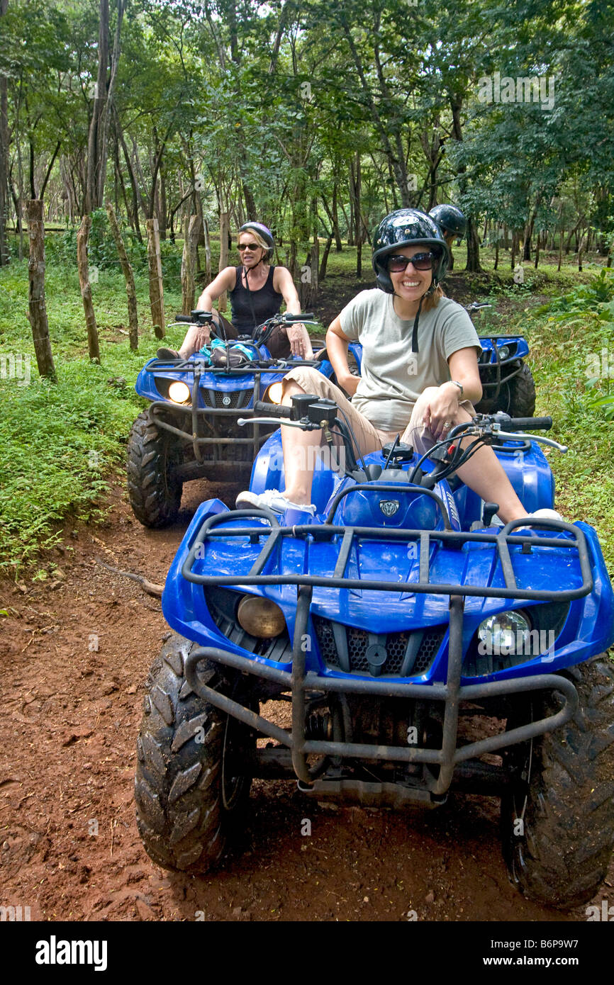 Women enjoy ATV tour through forest outside Tamarindo Costa Rica Stock ...