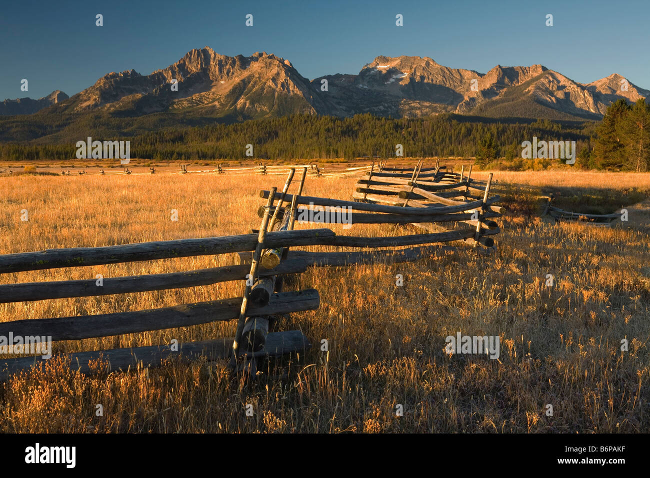 Sawtooth Mountains, near Stanley, Idaho, fall, fence line in the ...