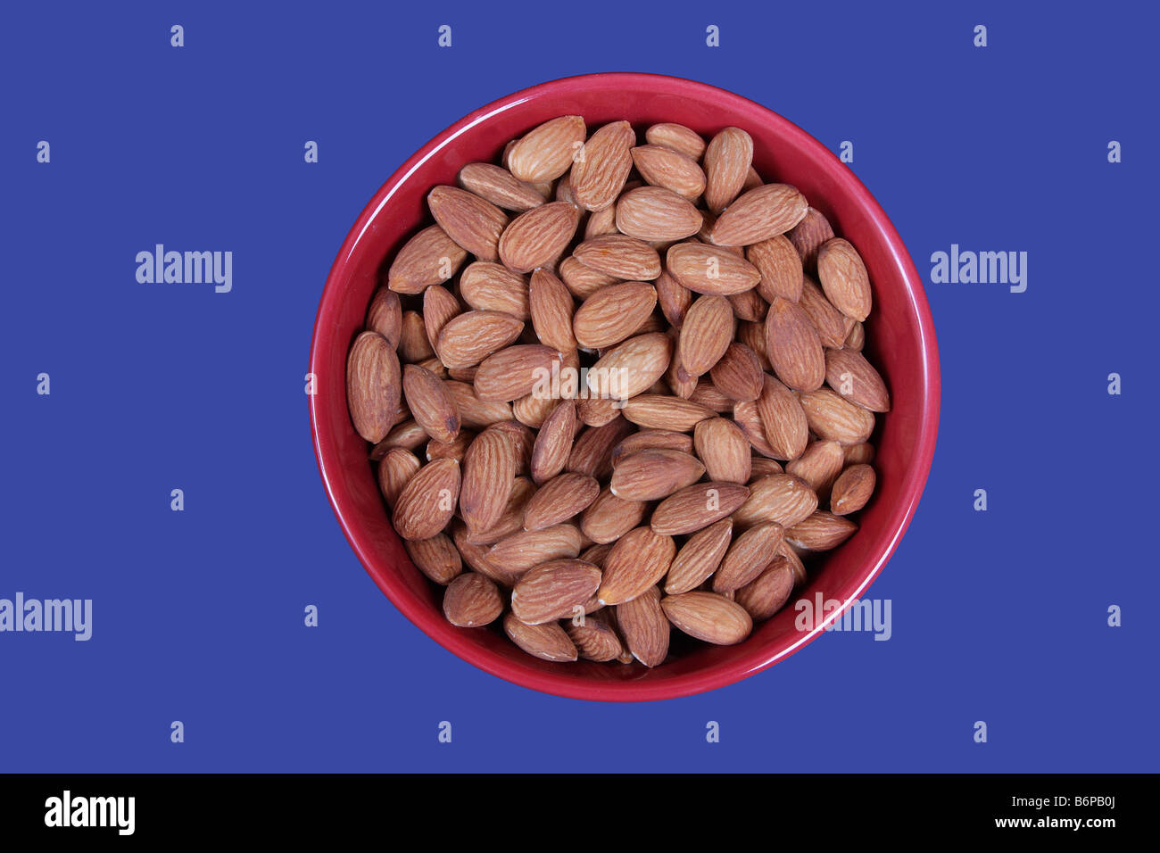 A Red Bowl of Raw Almonds Stock Photo - Alamy