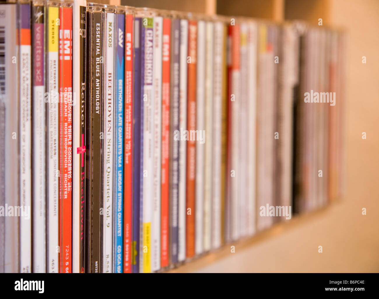 A shelf of Compact Discs showing spines with titles/artists names ...