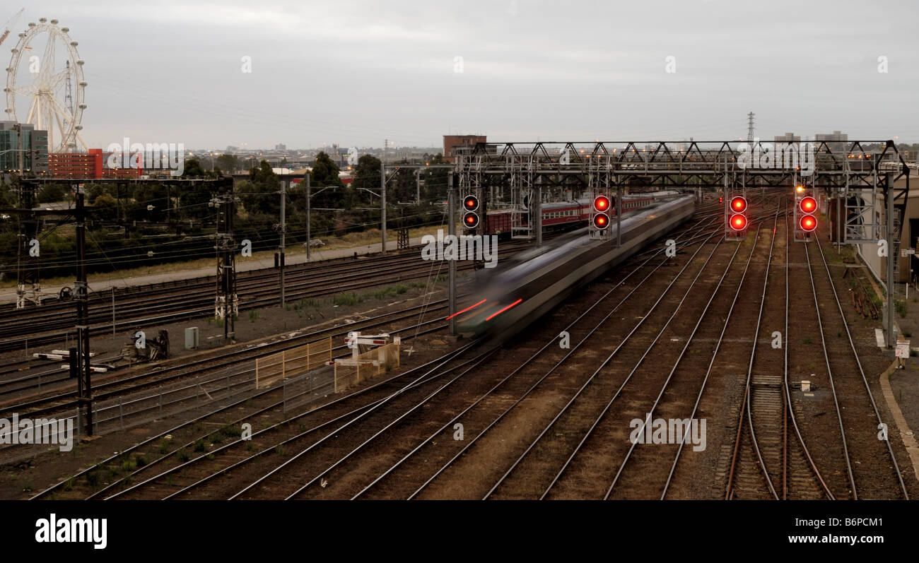 Speeding train in depot Stock Photo - Alamy