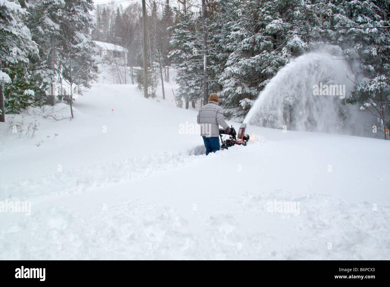 Snow Blowing a yard or driveway during the big storm of December in New ...