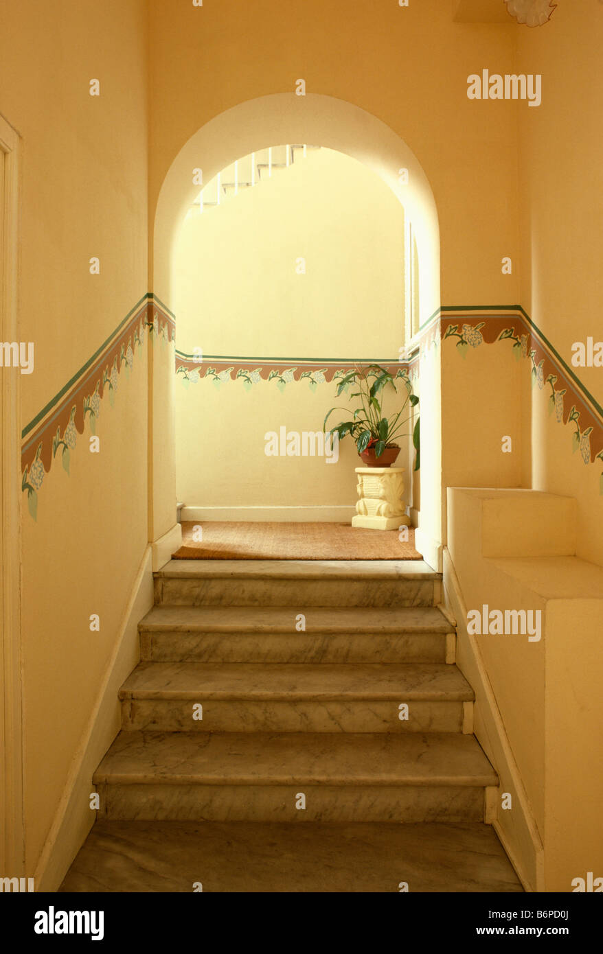 Hand painted dado border above marble stairs to arched hall Stock Photo ...