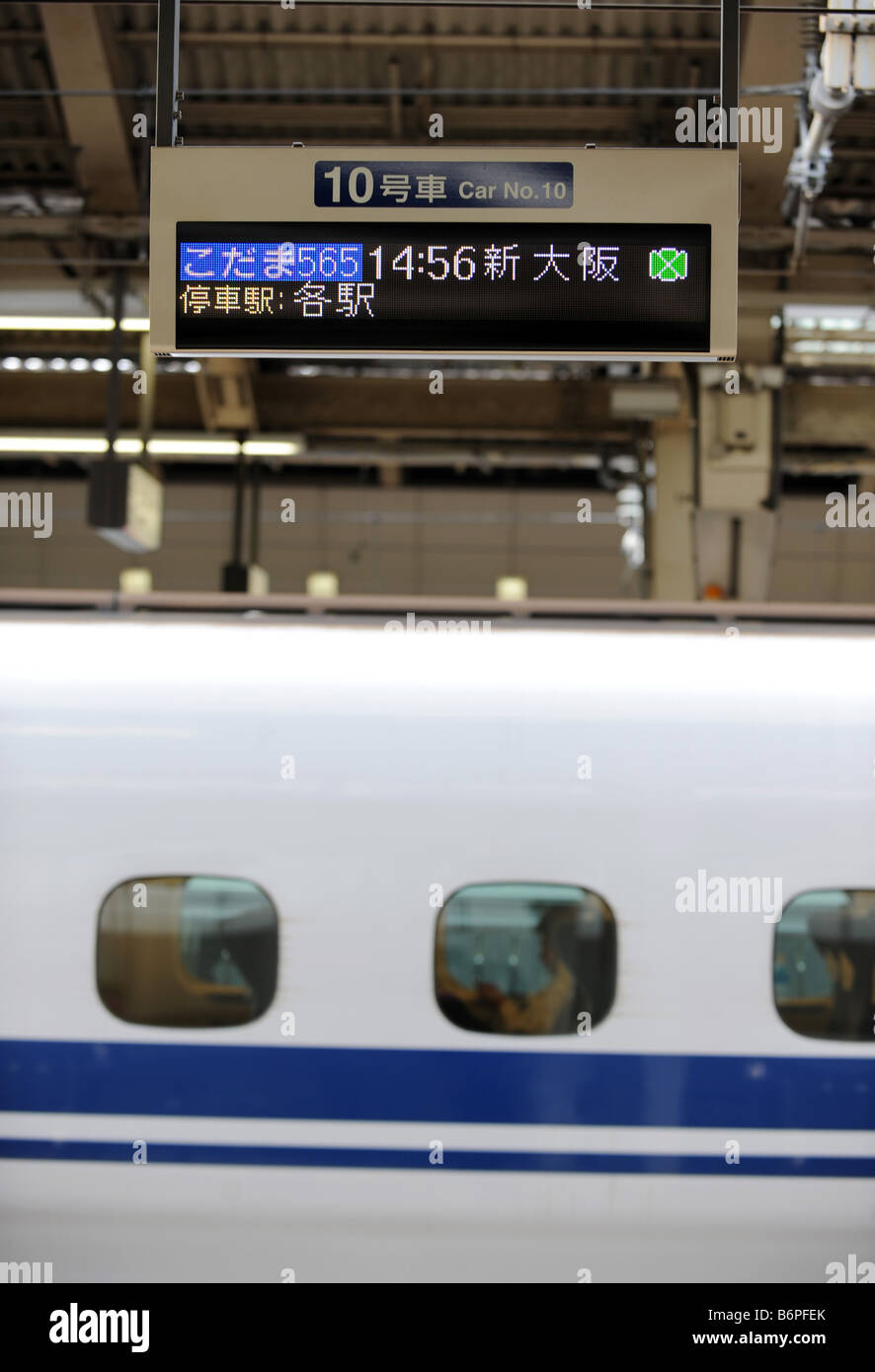 An electronic sign for the Shinkansen bullet train on the platform at ...