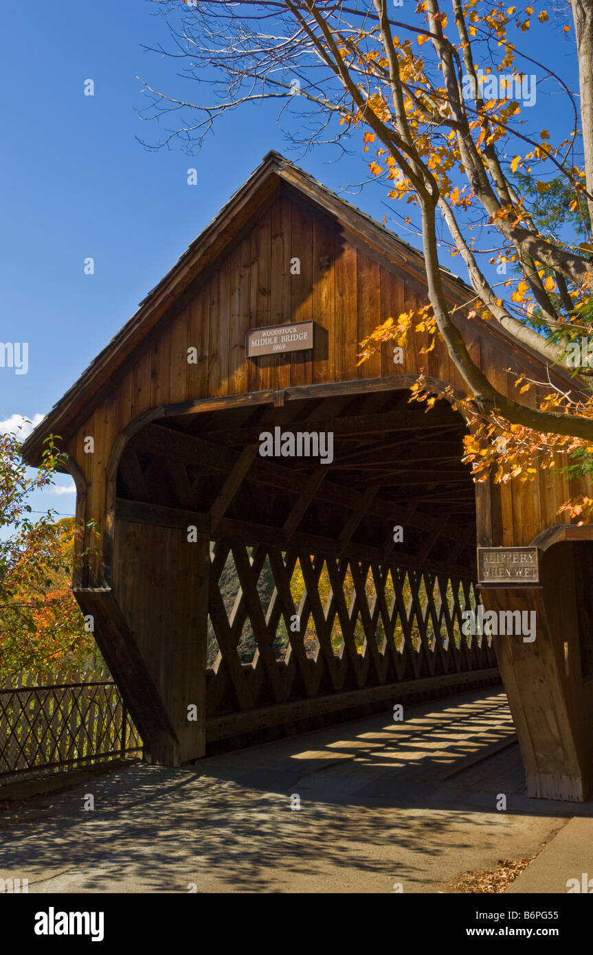 Autumn fall colours around traditional timber covered bridge middle ...
