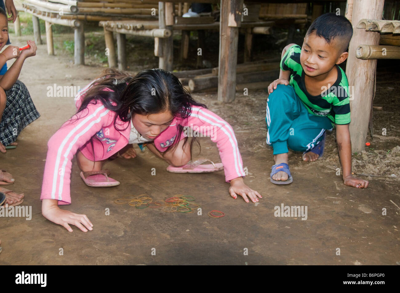 Burmese children playing a game in the Umpian refugee camp in Thailand ...