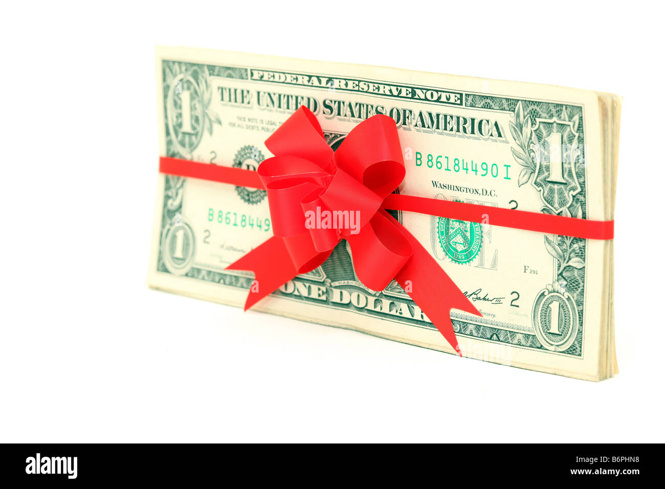 stack of dollar banknotes with red ribbon and bow isolated Stock Photo ...