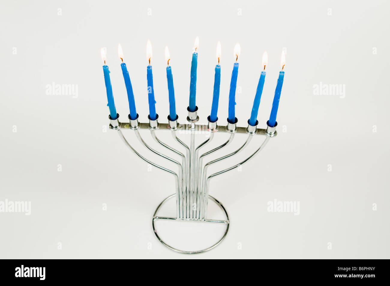 Silver Hannukah Menorah with blue candles on white background Stock ...
