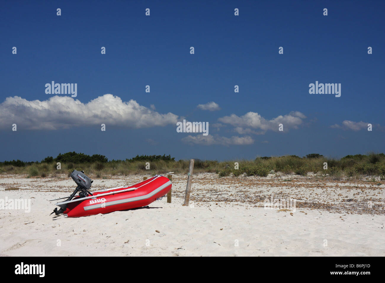 Red inflatable dinghy ashore Stock Photo - Alamy