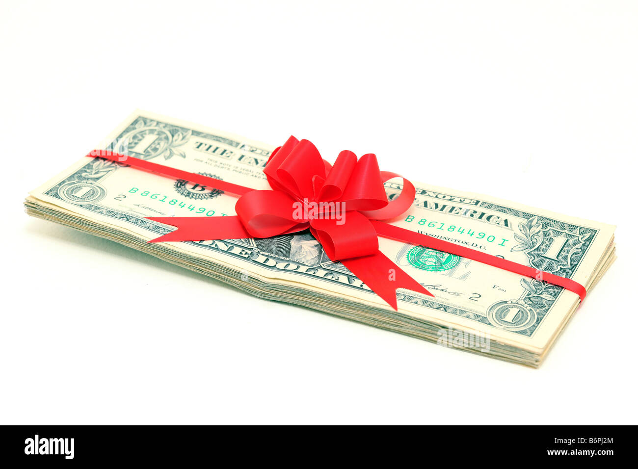 stack of dollar banknotes with red ribbon and bow isolated Stock Photo ...