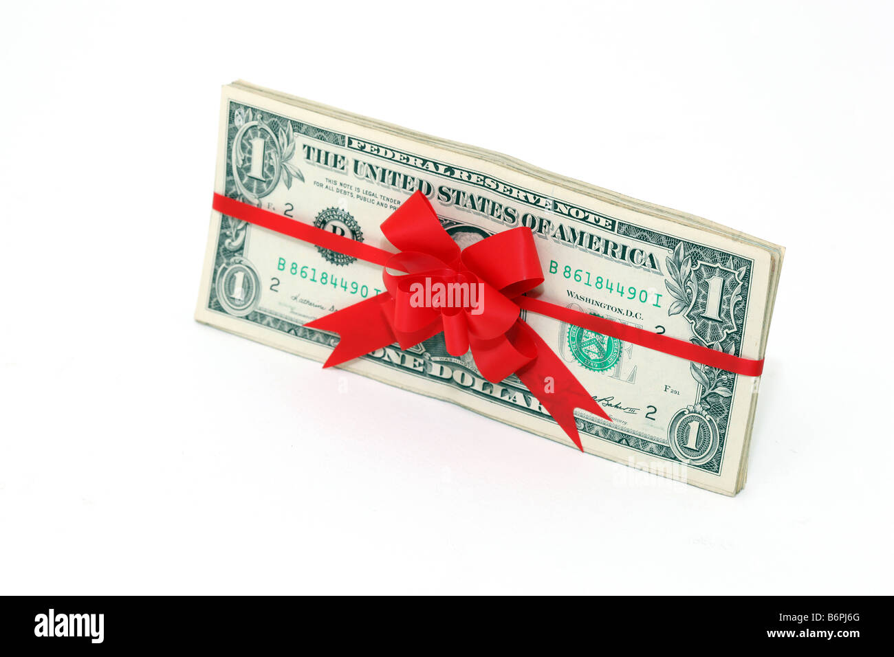 dollars gift banknotes present with red ribbon and bow isolated Stock ...