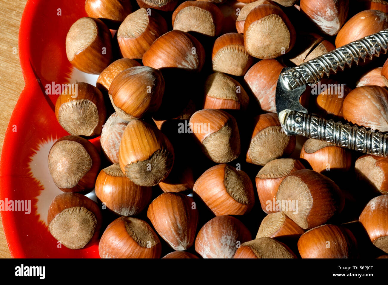 Hazelnuts and nutcracker Stock Photo - Alamy