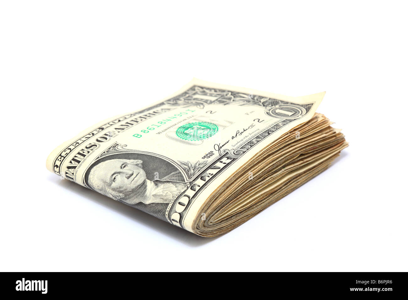 folded dollar banknotes closeup isolated on white background Stock ...