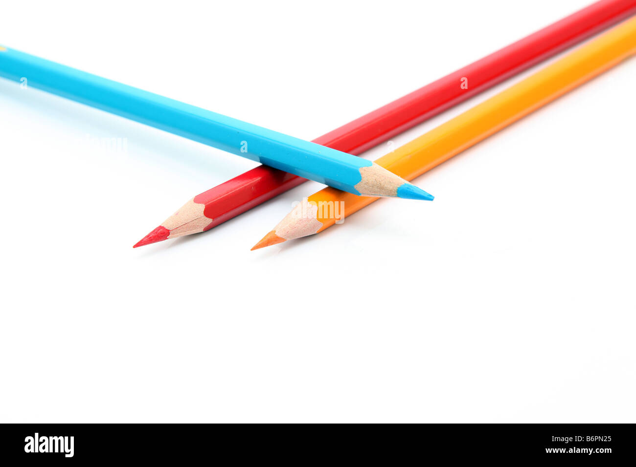 three color pencils with copyspace isolated Stock Photo - Alamy