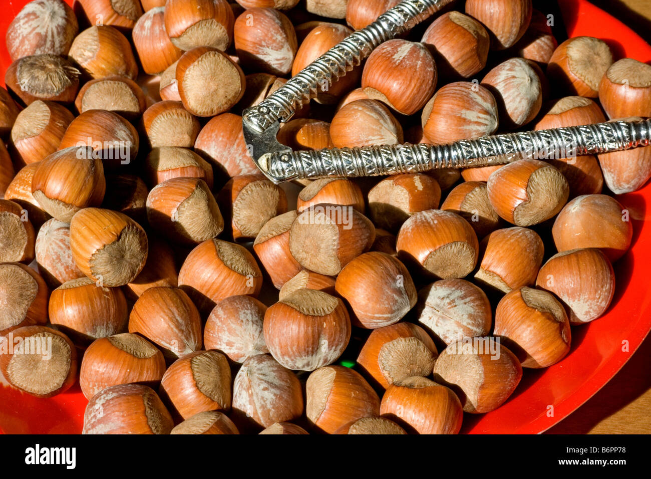 Hazelnuts and nutcracker Stock Photo - Alamy