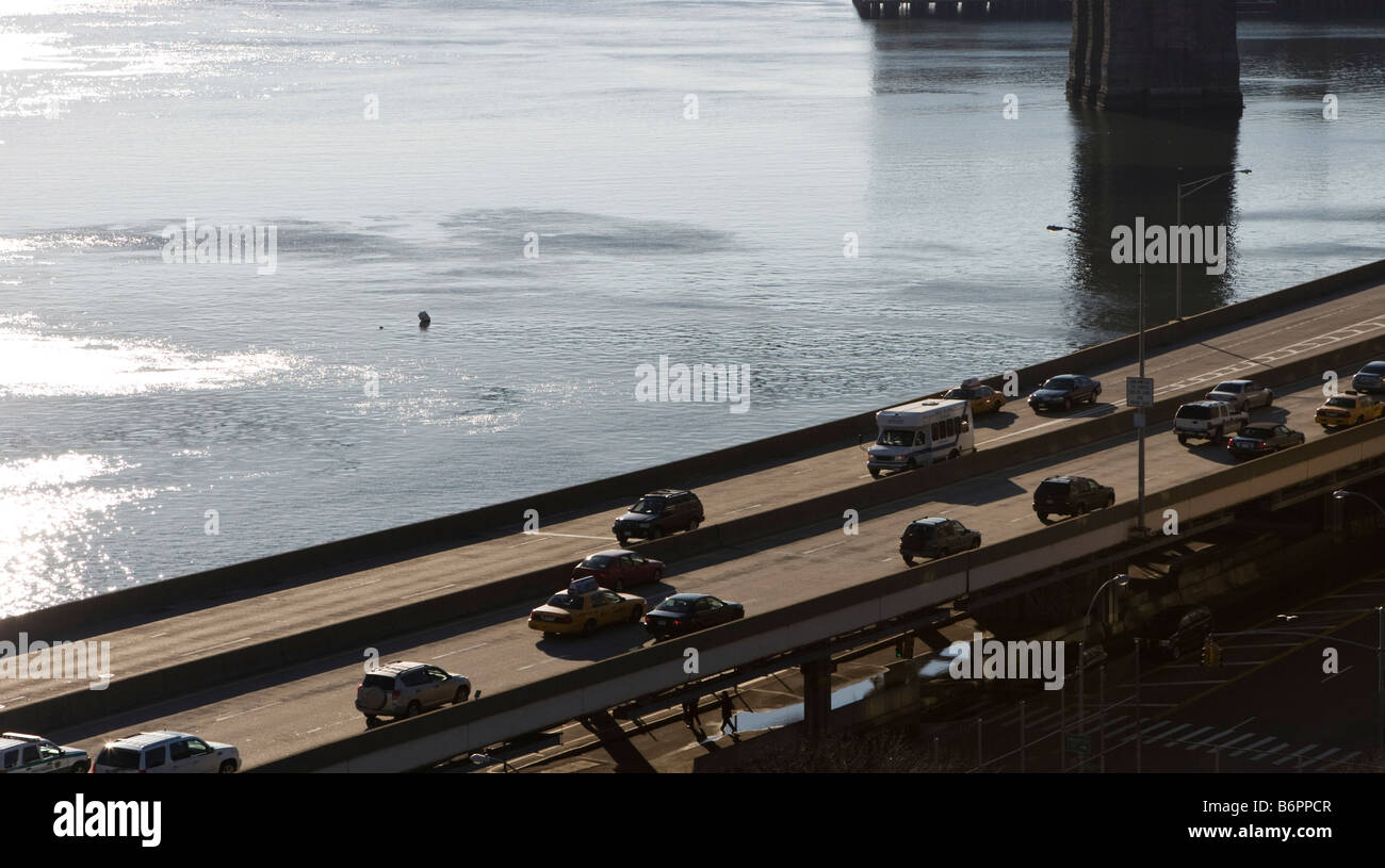 Cars are seen on the FDR Drive on the east side of Manhattan in New ...