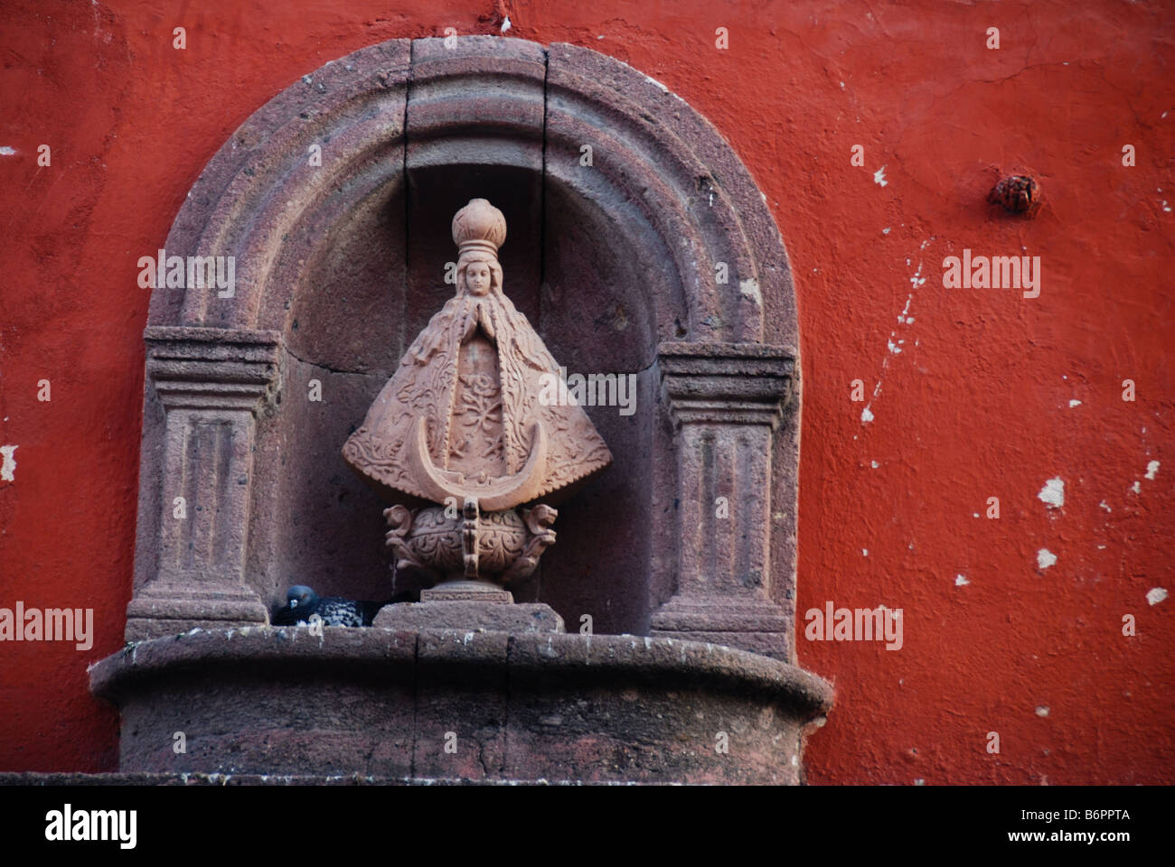 Religious statue in a nook in a wall Mexico Stock Photo - Alamy