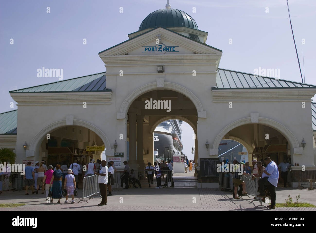 cruise passengers wait to pass through security check point at St Kitts ...
