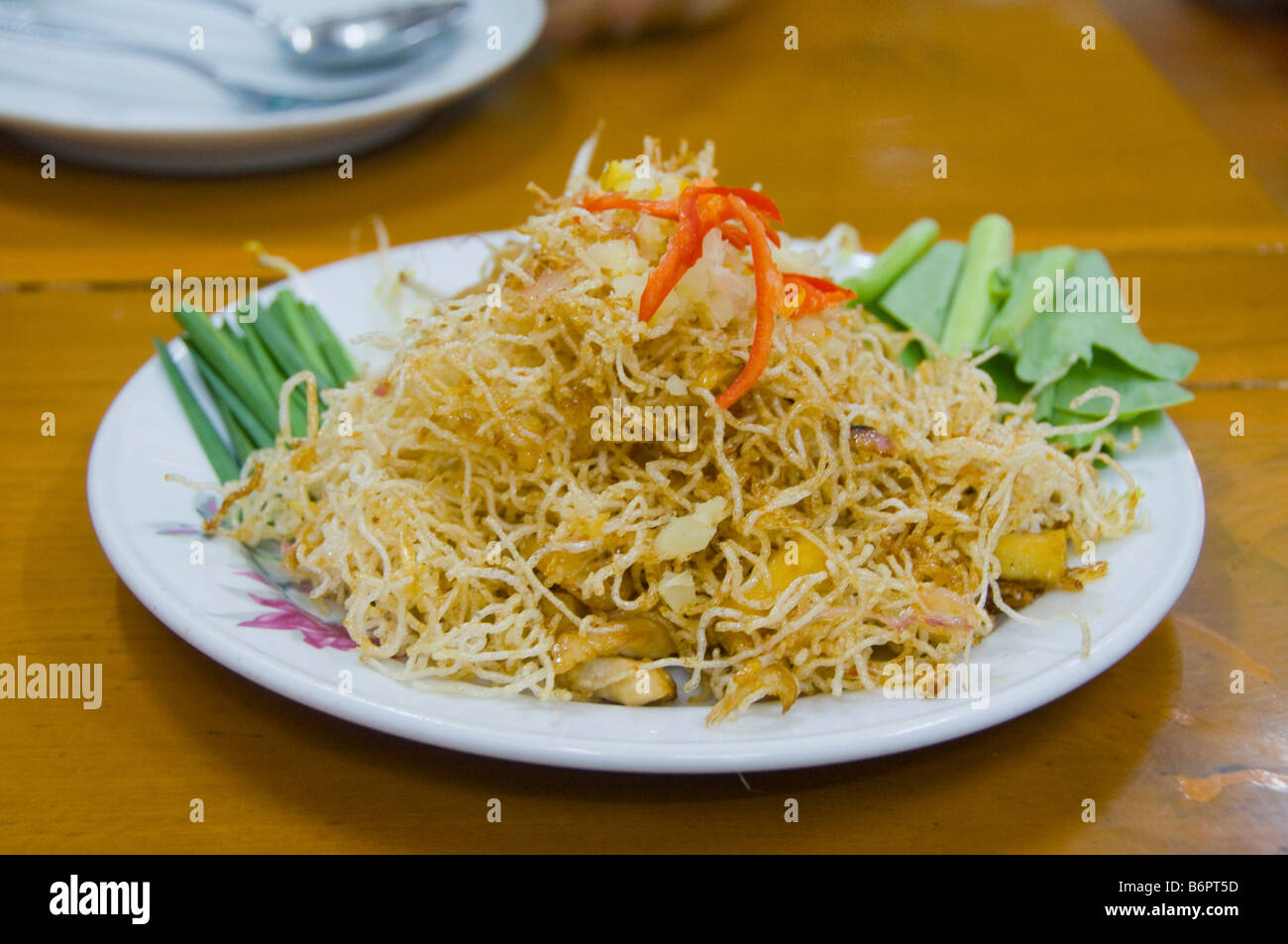 stylish mee crop crispy noodles with tamarind sauce at a restaurant in ...