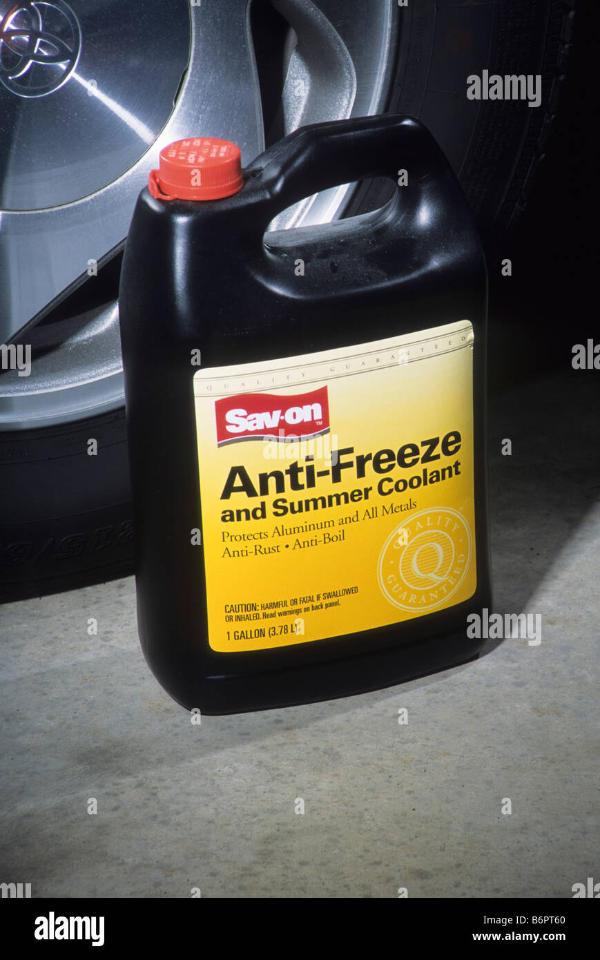 Bottle of anti-freeze solution for auto cooling system sits on floor ...