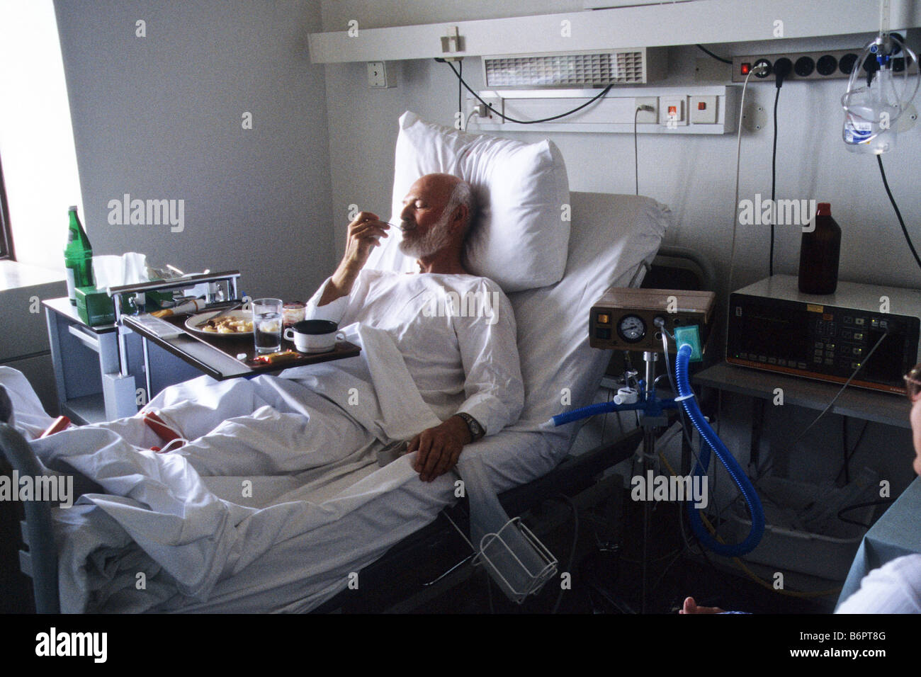 Man wiith beard recovers from heart surgery in hospital surrounded by ...