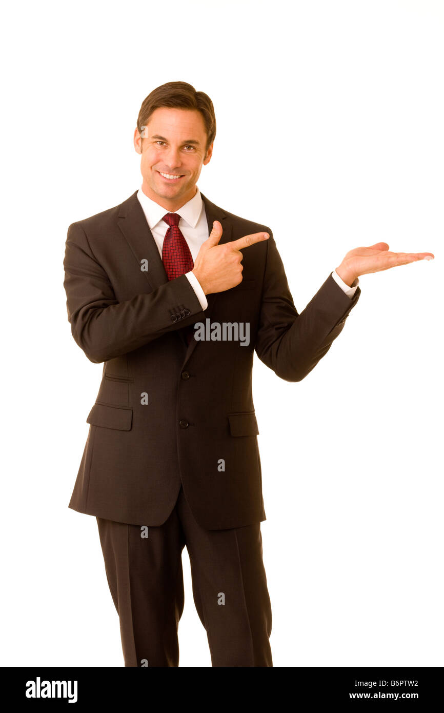 Corporate businessman with hand extended ready for a product to be ...