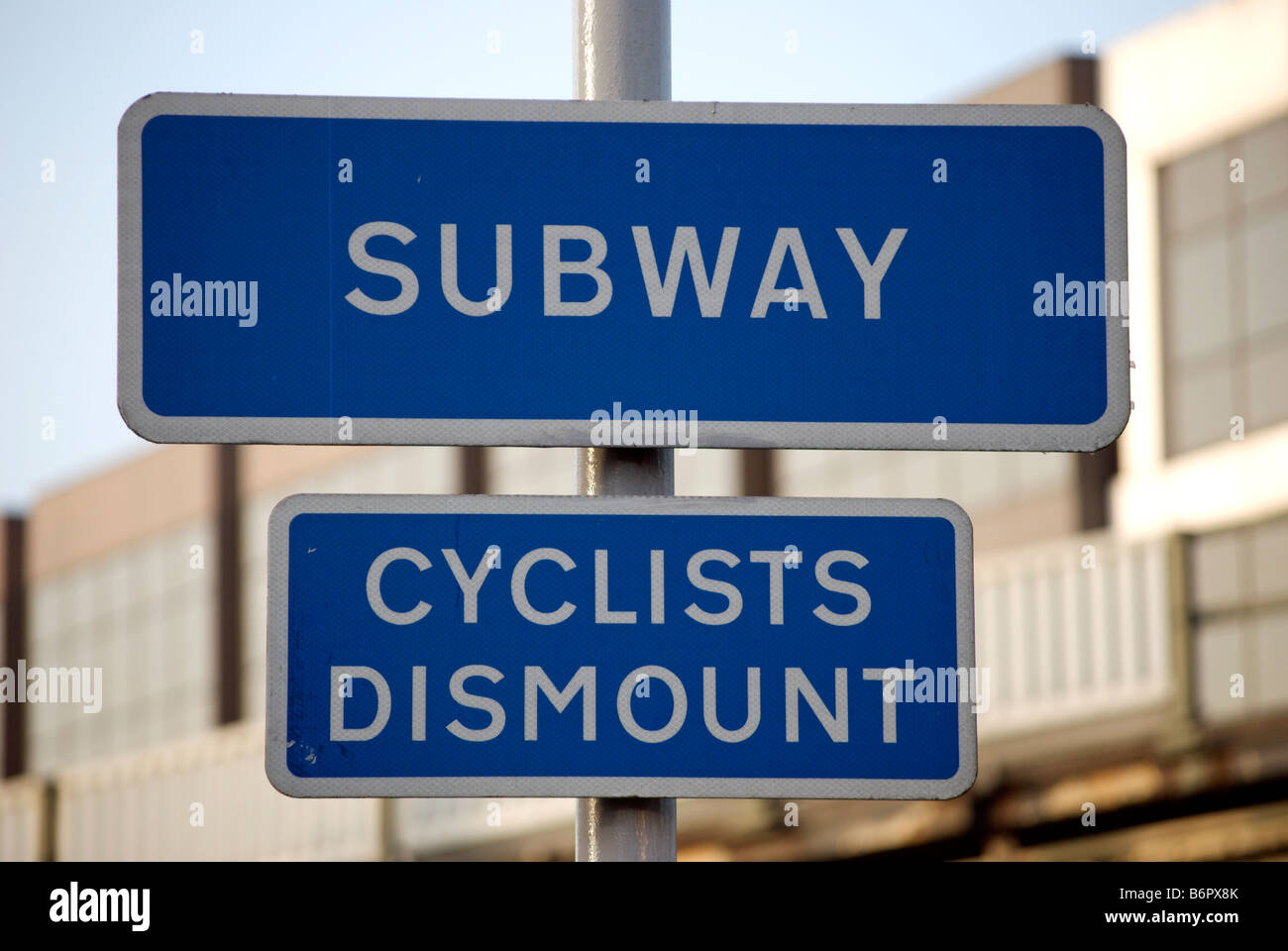 british blue and white street signs indicating pedestrian subway and ...