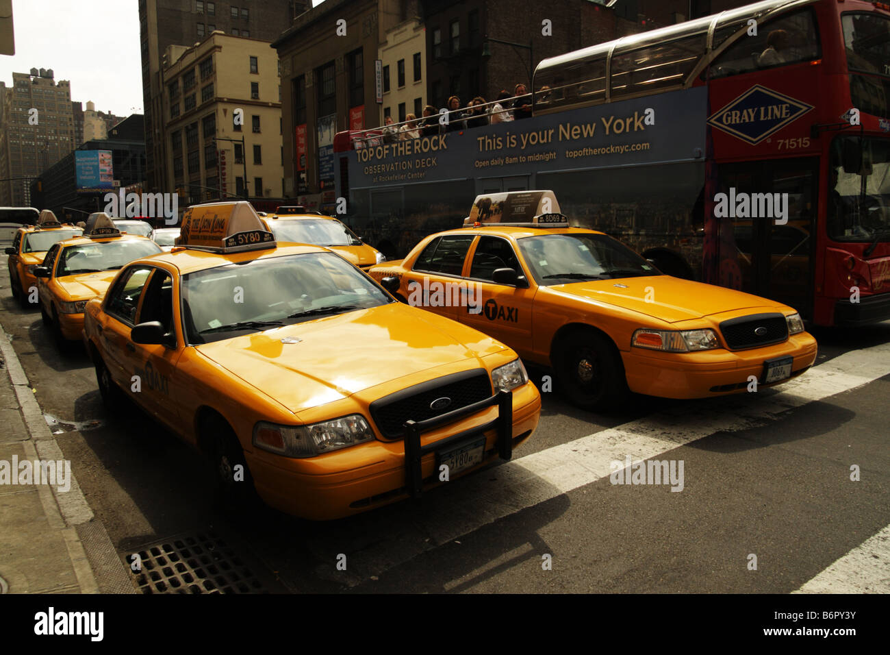 Yellow cabs in downtown Manhattan traffic Stock Photo - Alamy