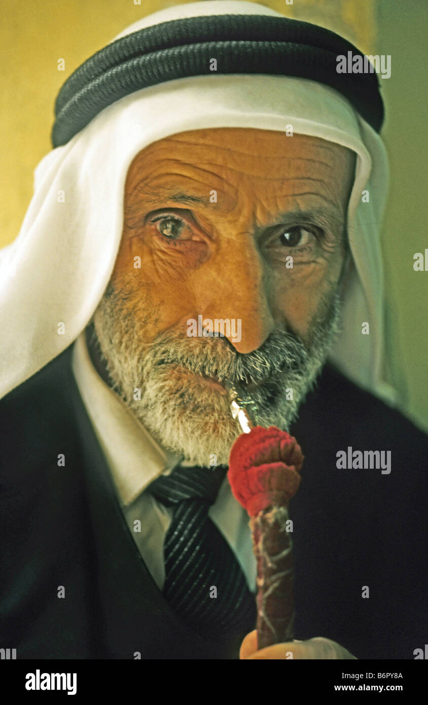 old arab with keffiyeh and agal smoking hookah, Israel, Jerusalem Stock ...
