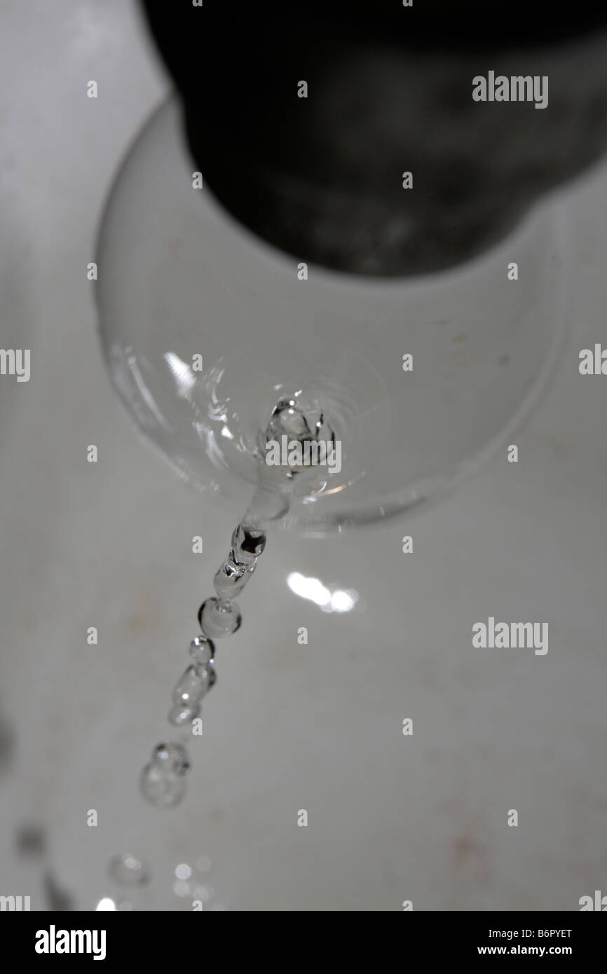 Air bubble formed on spout of water tap Stock Photo - Alamy