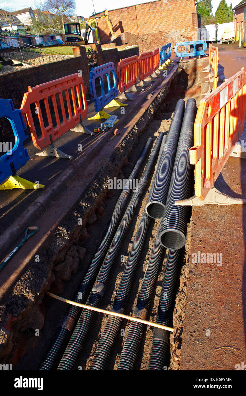 The laying of electrical cabling in road Stock Photo - Alamy