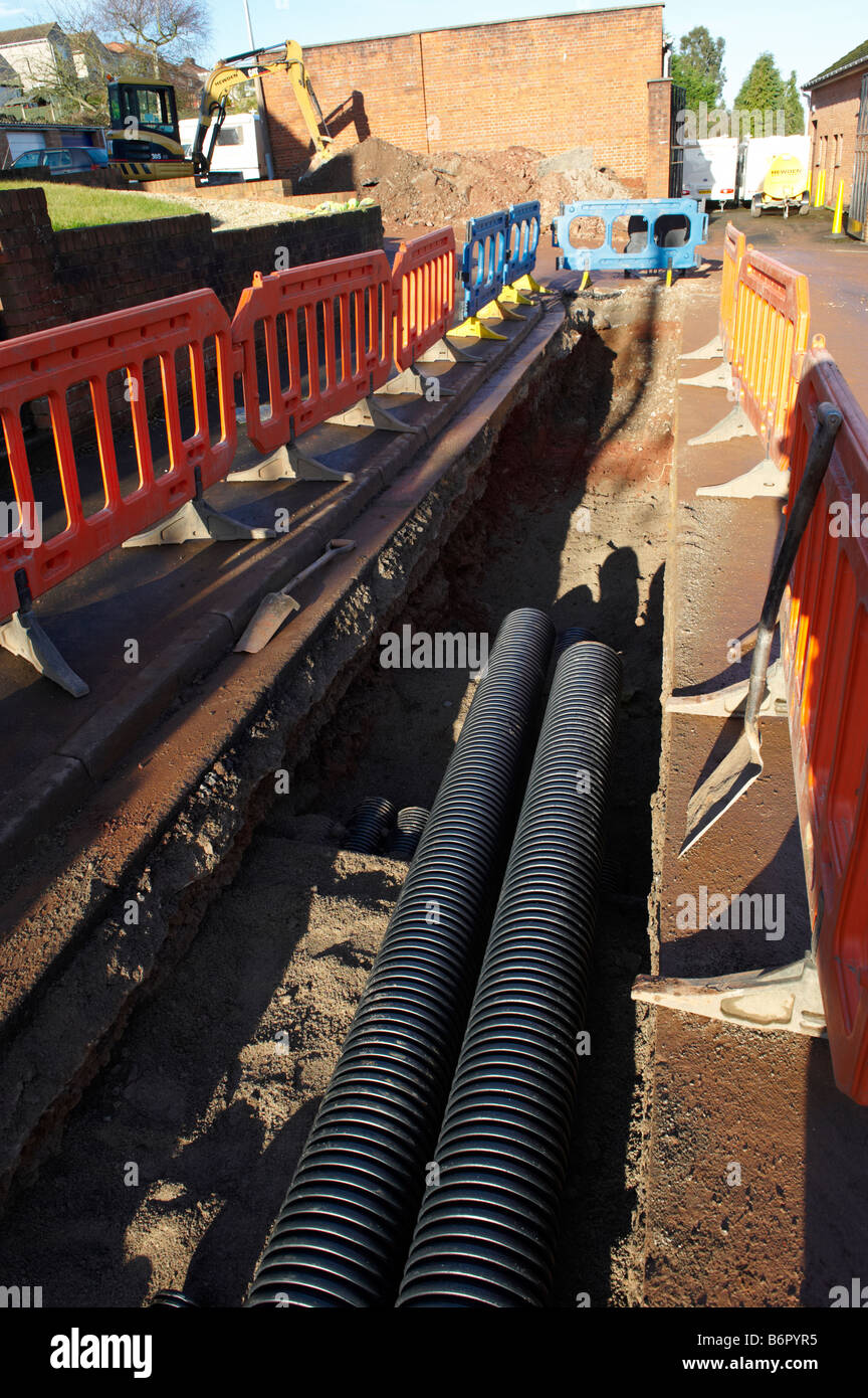 The laying of electrical cabling in road Stock Photo - Alamy