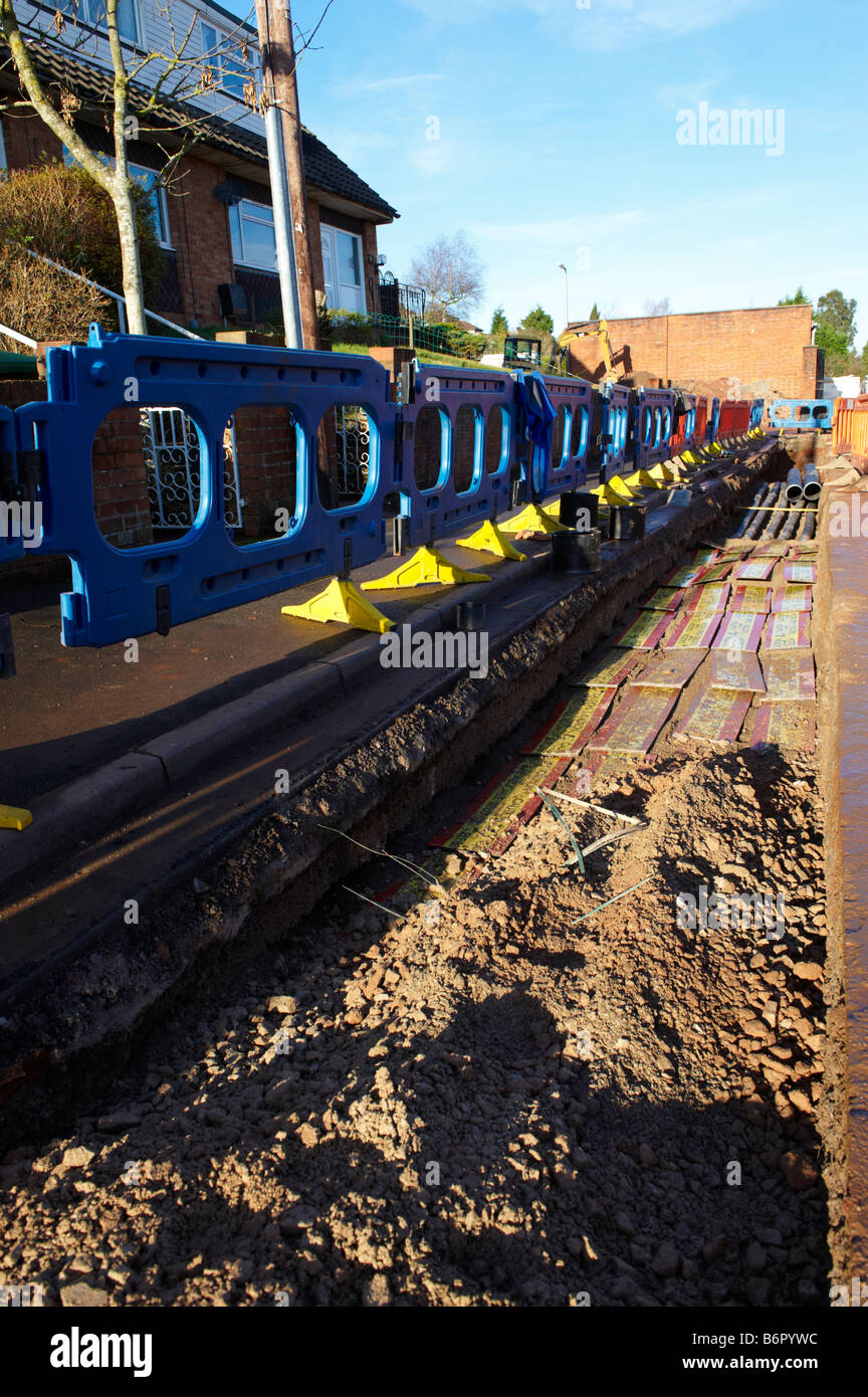 The laying of electrical cabling in road Stock Photo - Alamy