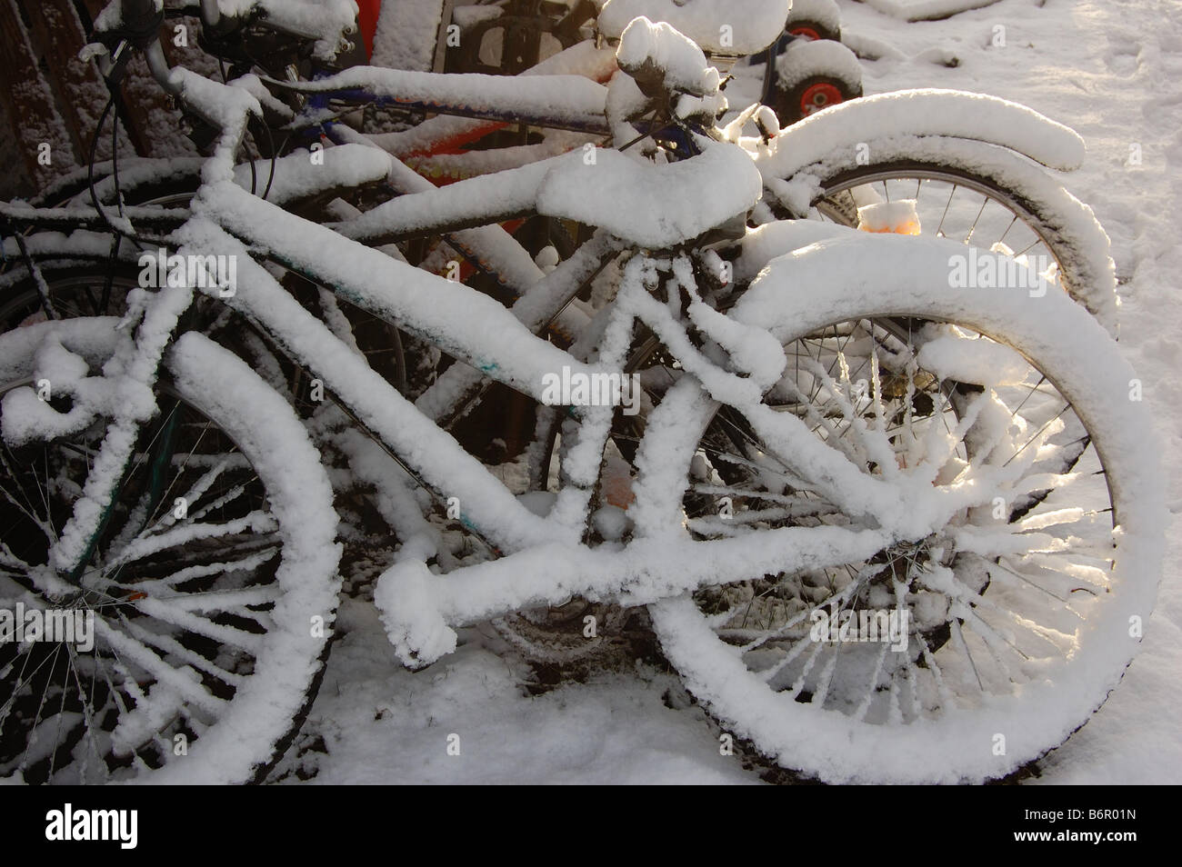 snow covered bicycles Stock Photo - Alamy