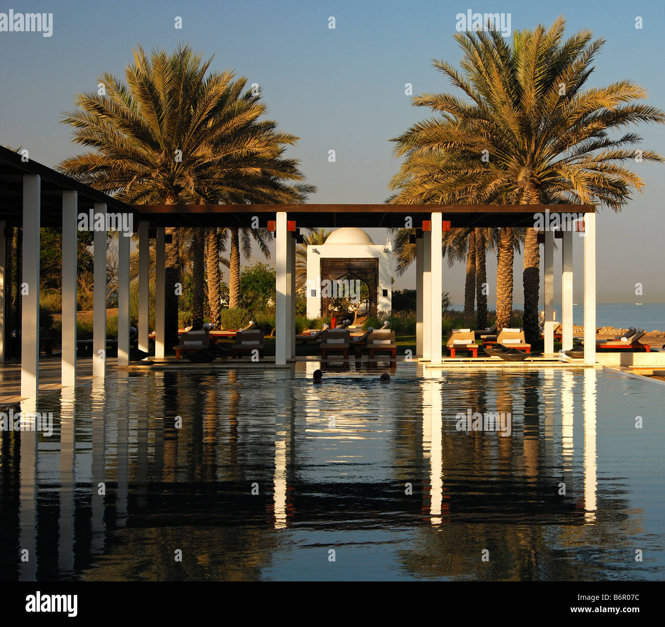 Calm morning at the swimming pool, The Chedi Hotel Muscat, Sultanat of ...