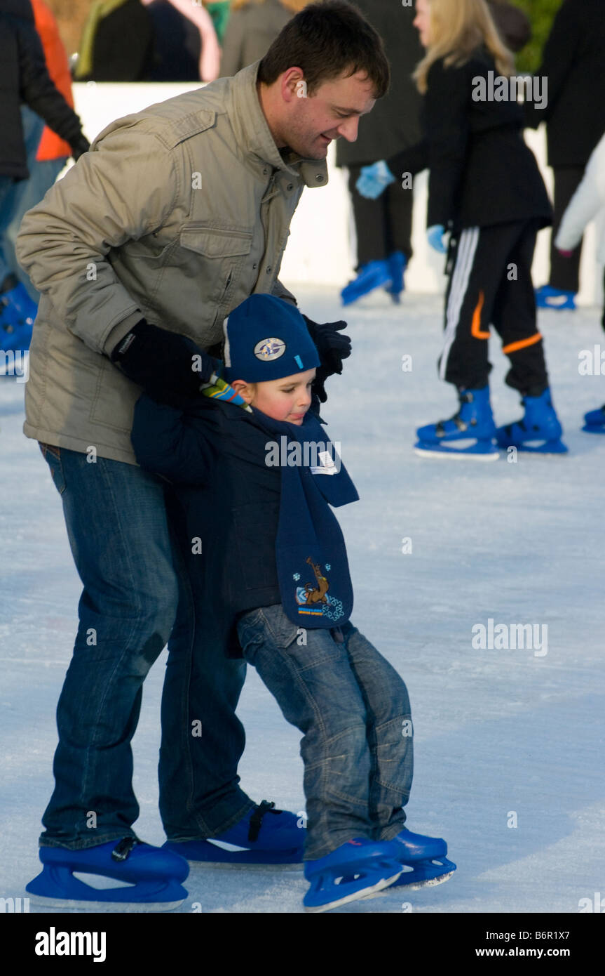 People Father and Son Ice Skating outdoors Stock Photo - Alamy