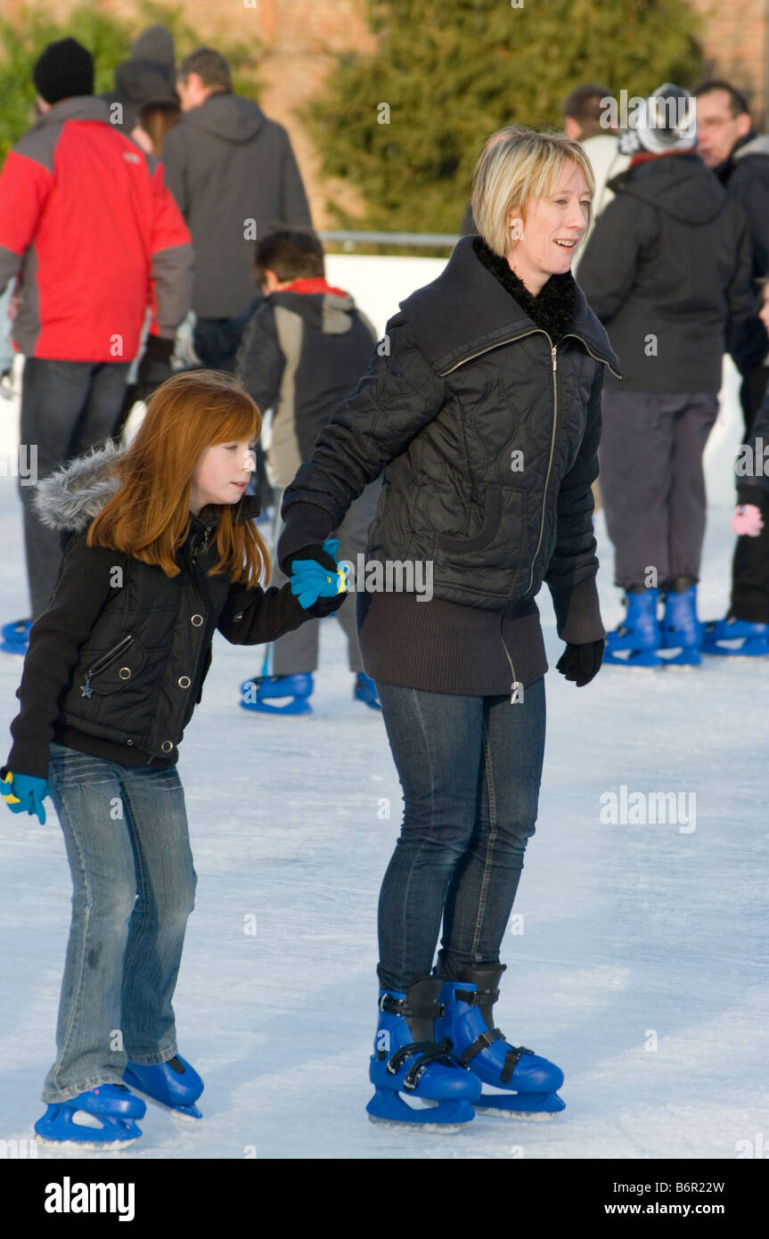 People Ice Skaters Skating holding hands Stock Photo - Alamy