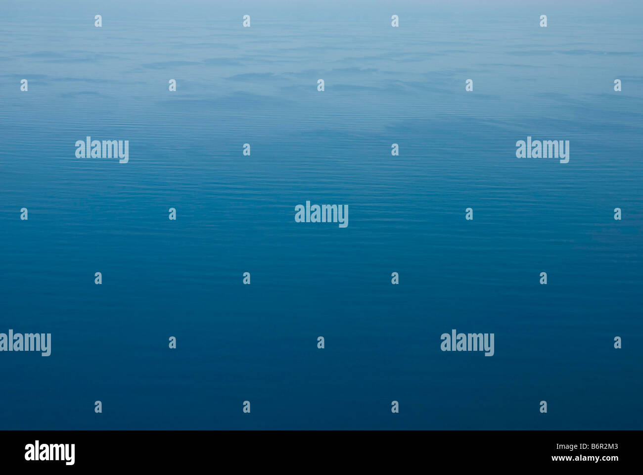 Aerial view of calm blue tropical sea Stock Photo - Alamy