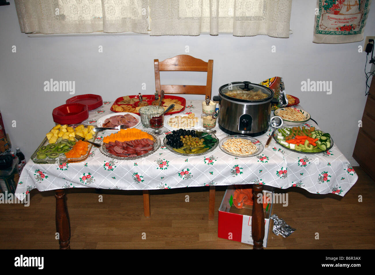Table with potluck spread food dishes Stock Photo - Alamy
