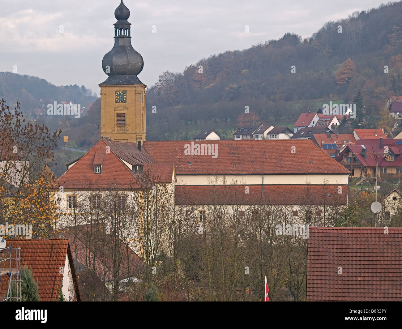 monastery beer brewery village in the green landscape trees mountains ...