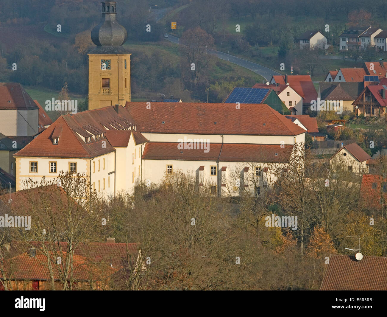 monastery beer brewery village in the green landscape trees mountains ...