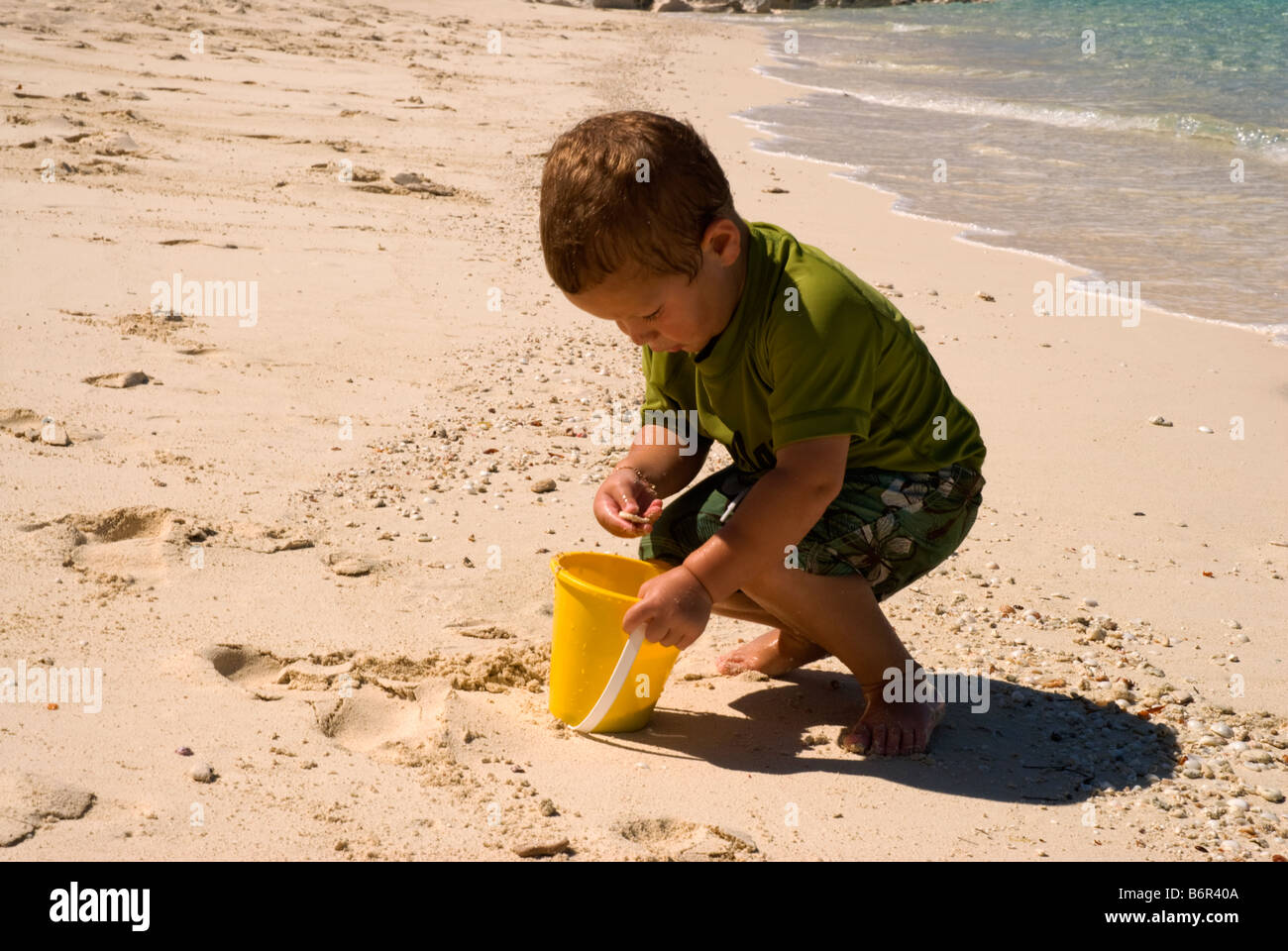 Boy playing on beach Rose Island Bahamas Stock Photo - Alamy