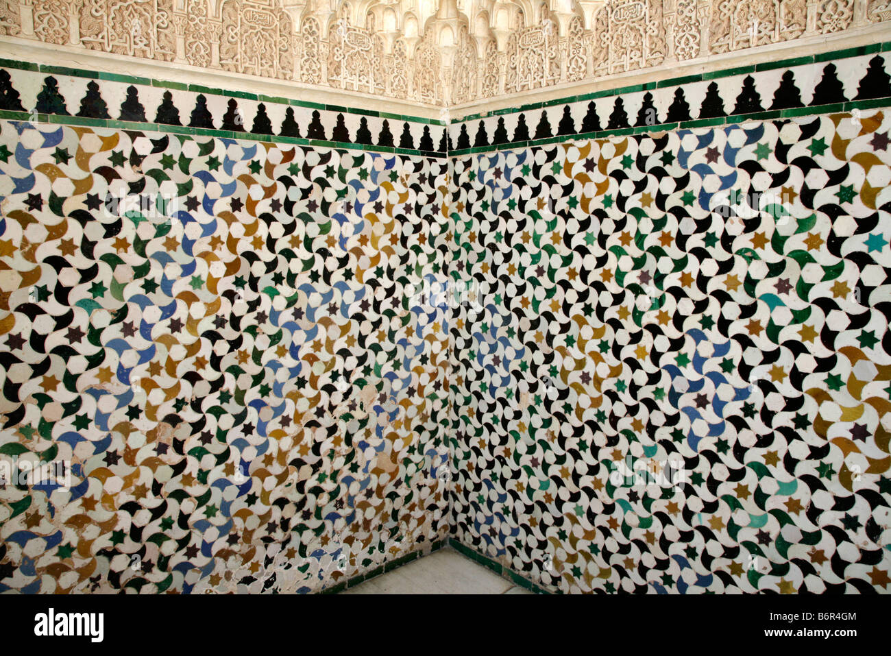 A colourful tiled wall inside the Alhambra Granada Spain Stock Photo ...