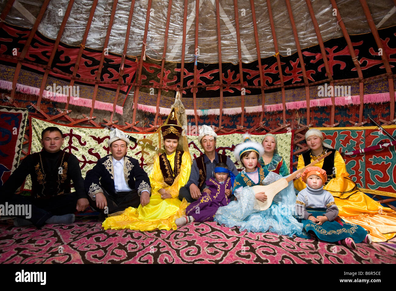 Kyrgyz group in traditional attire posing inside a nomadic yurt Stock ...