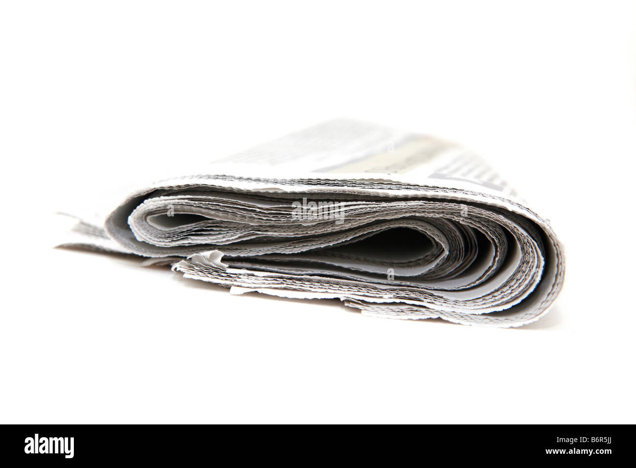 closeup detail from folded newspaper isolated on white background Stock ...
